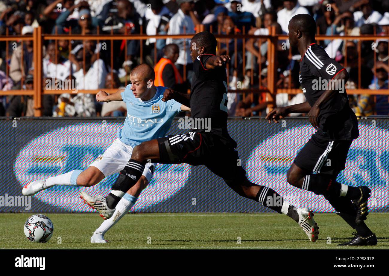 Manchester City's Vladimir Weiss, left, attacks as South Africa's ...