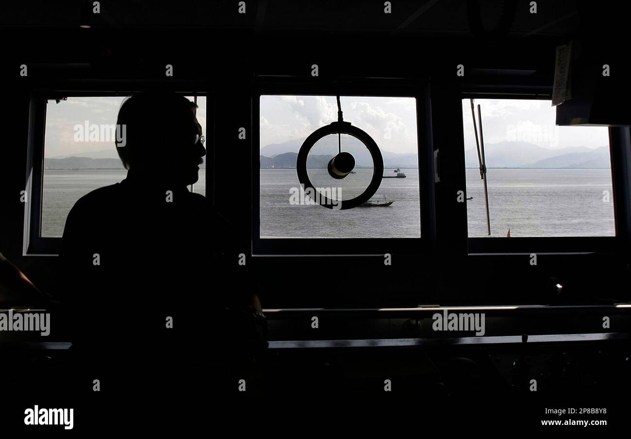 Robert Reish, captain of the USNS Bruce C. Heezen is seen at the bridge ...