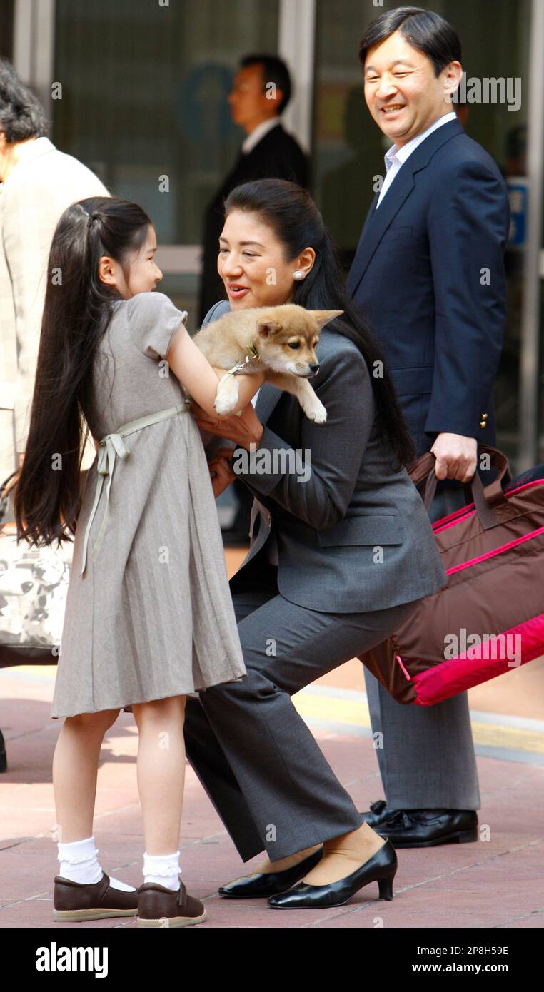 Crown Princess Masako, center, receives family dog Yuri from Princess ...