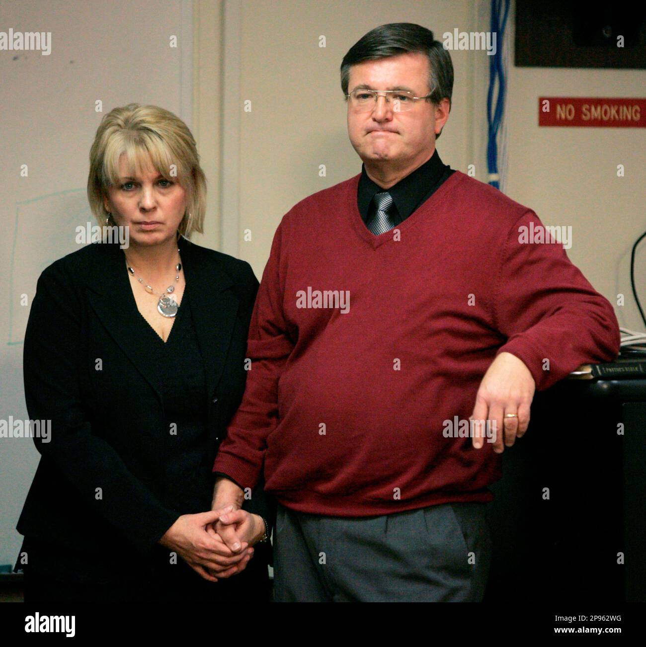 Debbie Baskin, left, holds hand with her husband Mark Baskin after ...
