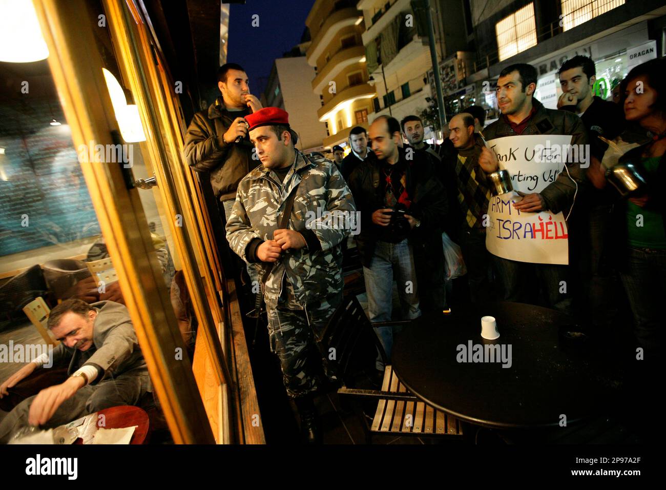 A customer, left, sits inside the Starbucks Coffee shop as Lebanese ...