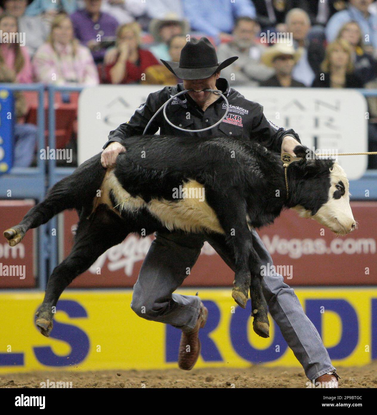 Trevor Brazile, of Decatur, Texas, competes during the ninth go-round ...