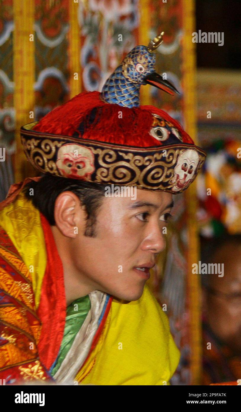 Bhutan's 5th King Jigme Khesar Namgyal Wangchuk interacts with an ...