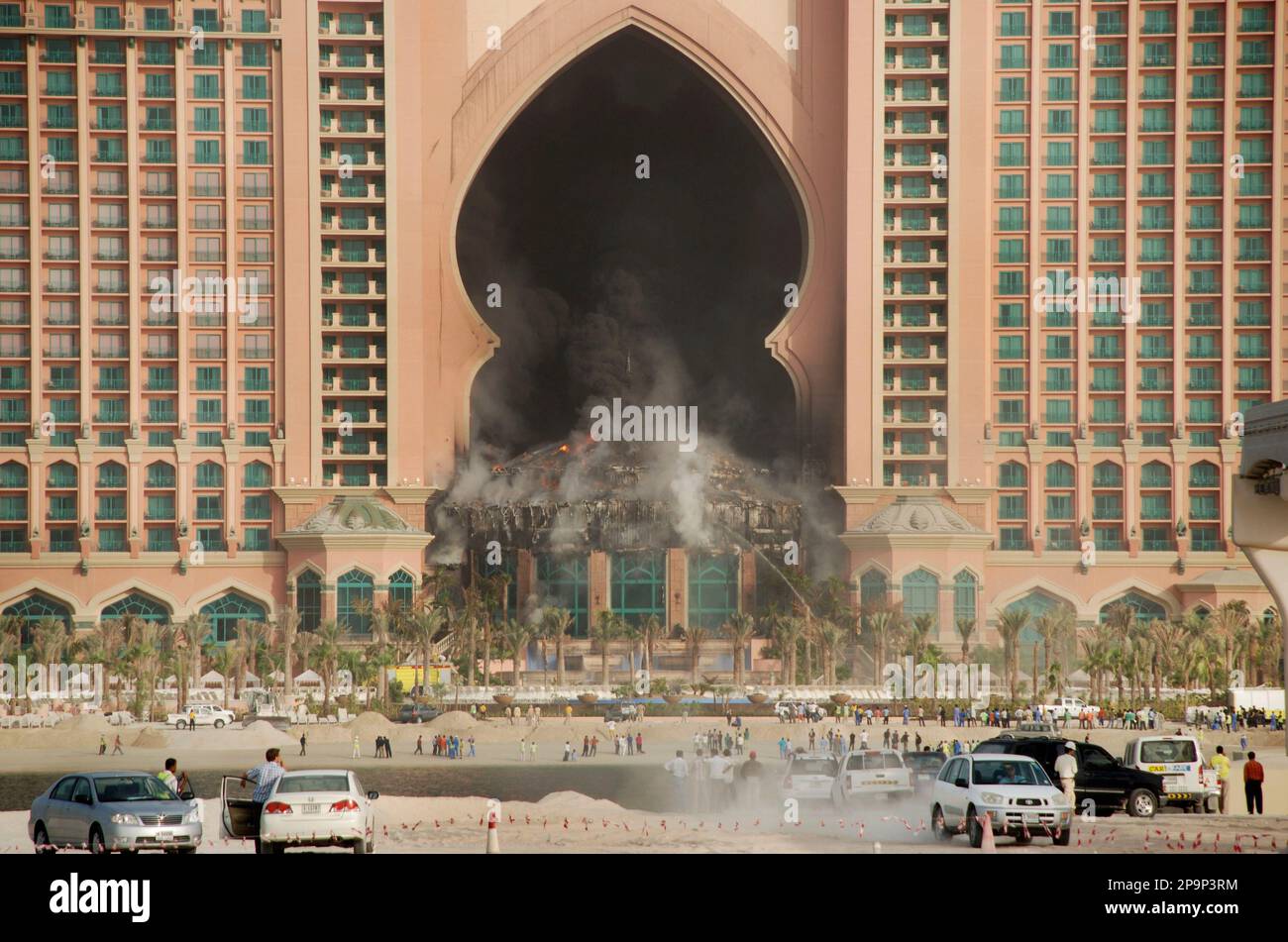 A fire burns in the five-star Atlantis hotel, which was set to open ...