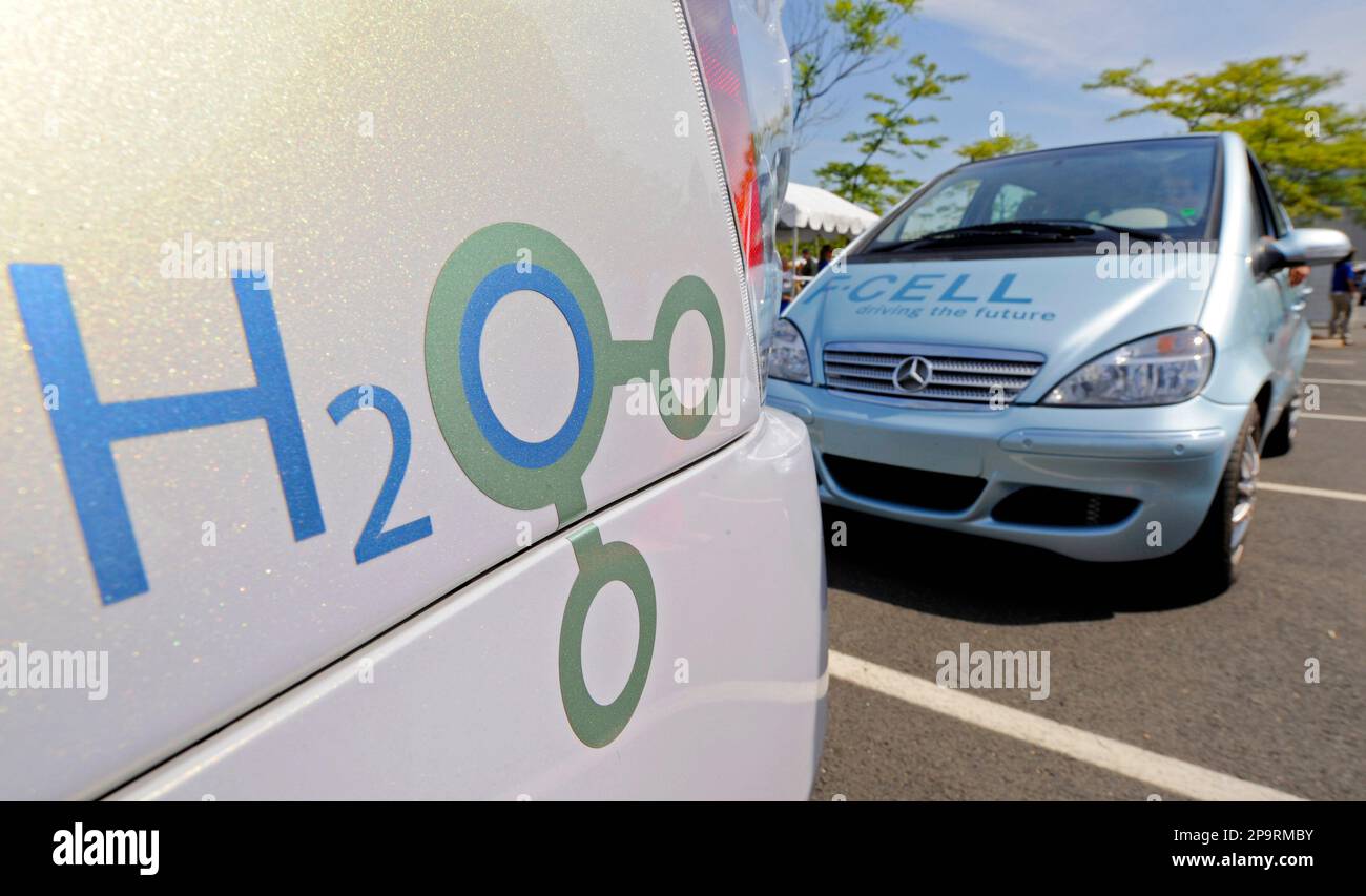 The logo on a hydrogen-powered GM vehicle, left, preceeds a hydrogen ...