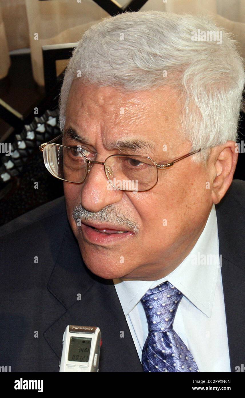 Palestinian President Mahmoud Abbas talks to reporters following a ...