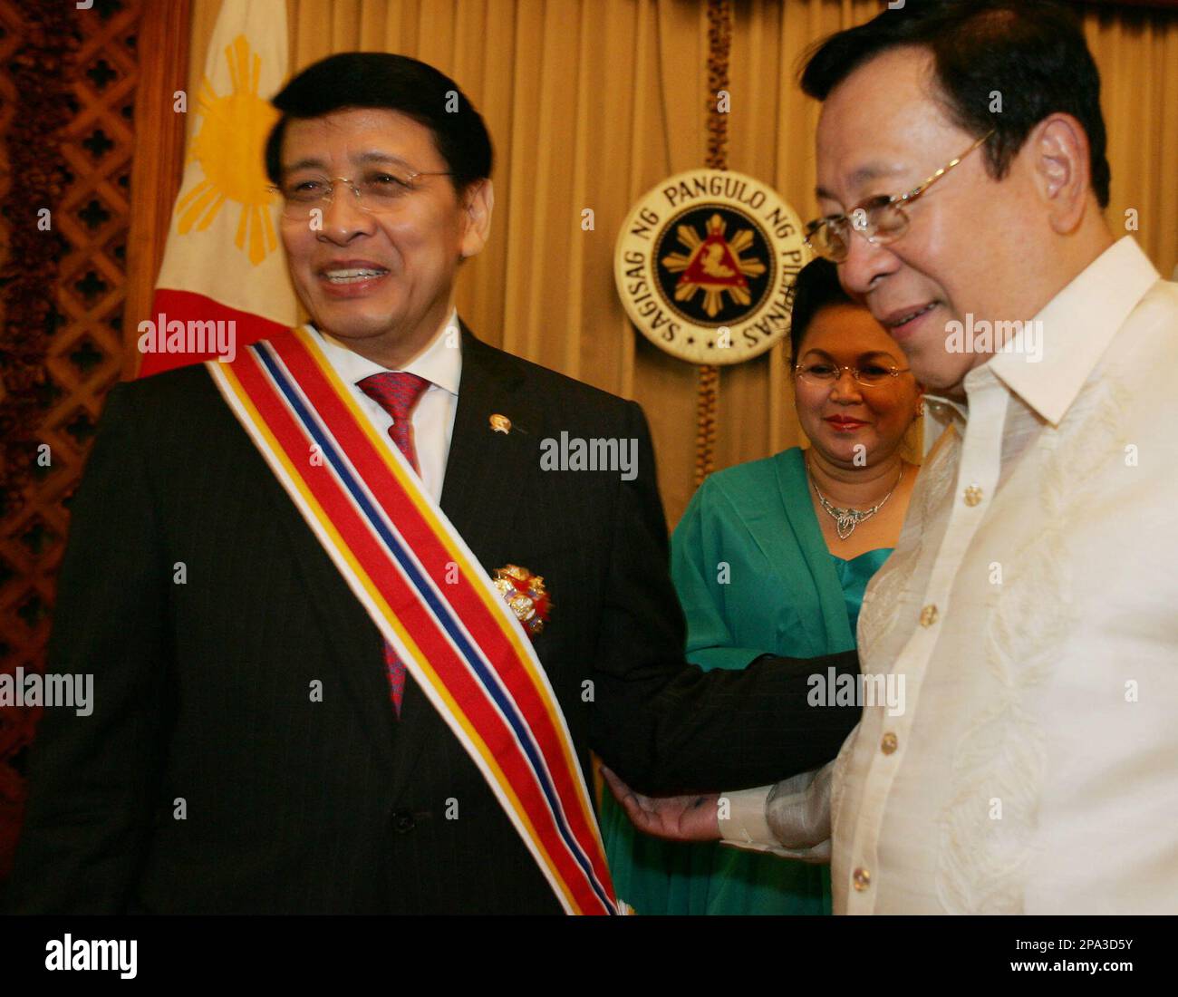 Indonesian Foreign Minister Hassan Wirajuda, left, is congratulated by ...