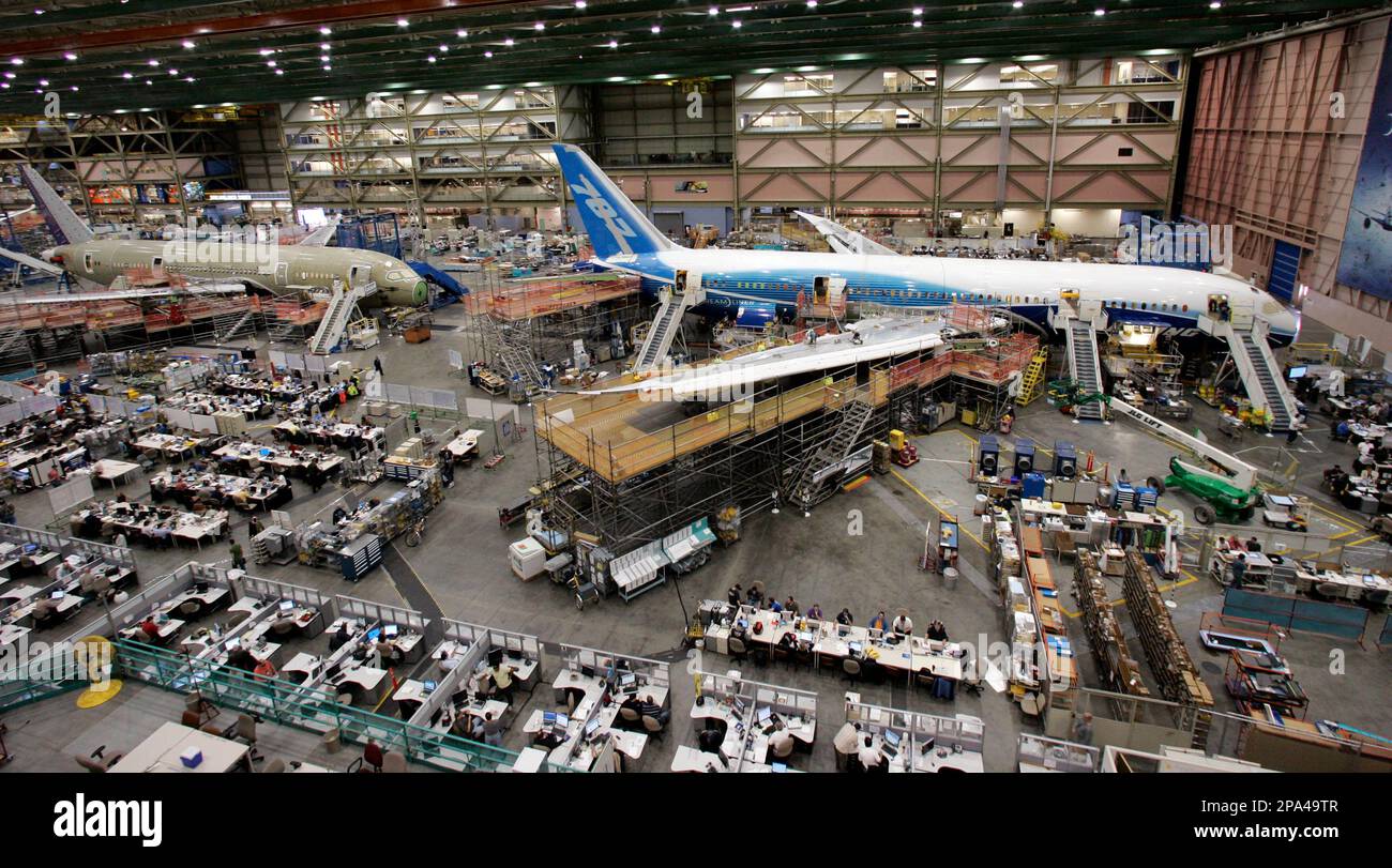 Boeing 787 jets are lined-up nose to tail and surrounded by rows of ...