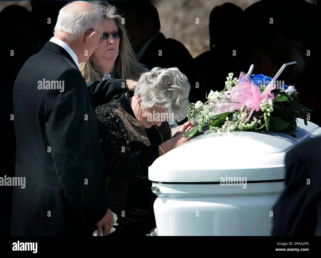 Bill Sueppel Sr. comforts his wife Patricia has she stands over the ...