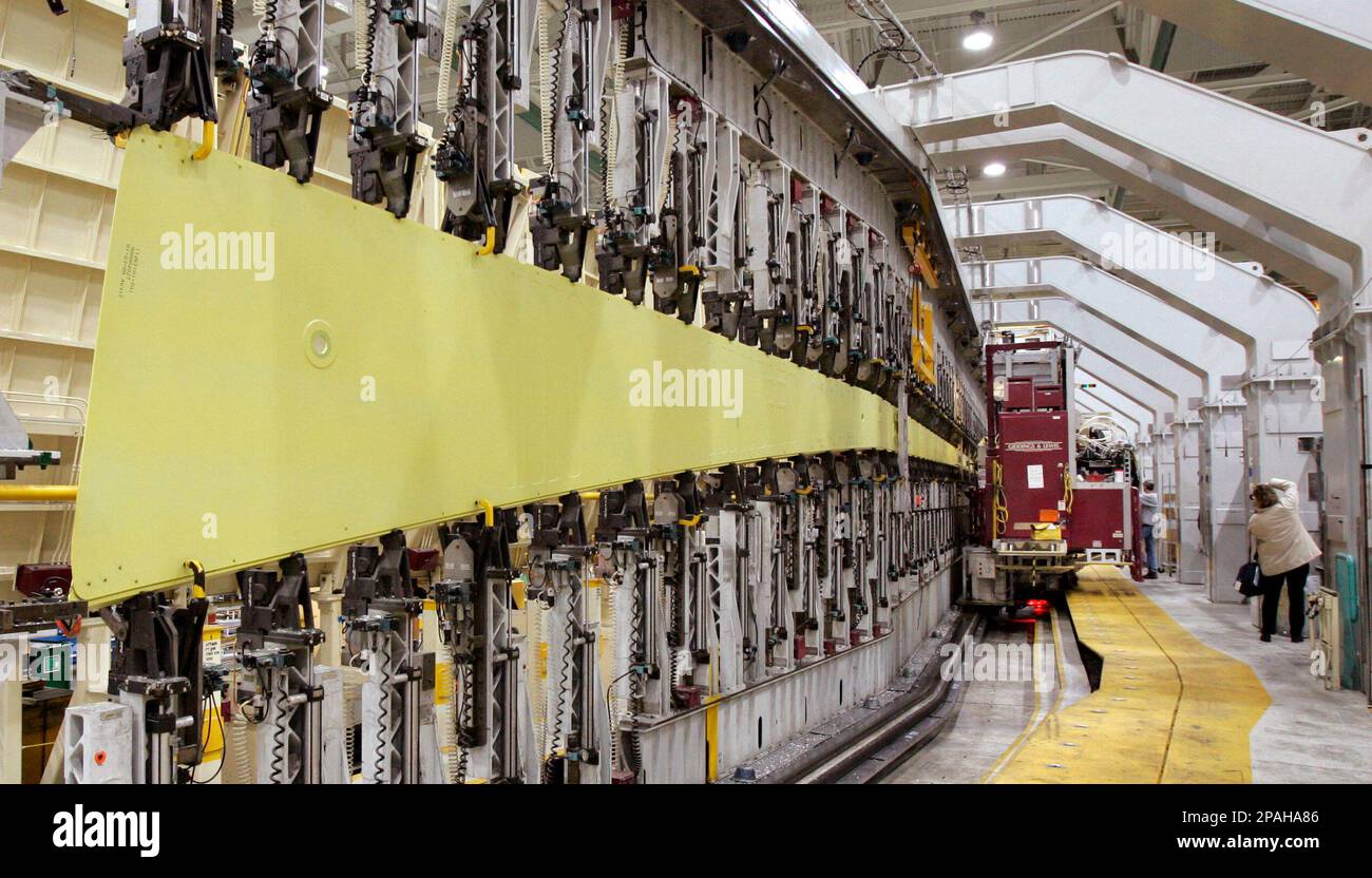 An Automated Spar Assembly Tool (ASAT) works on the first spar, a ...