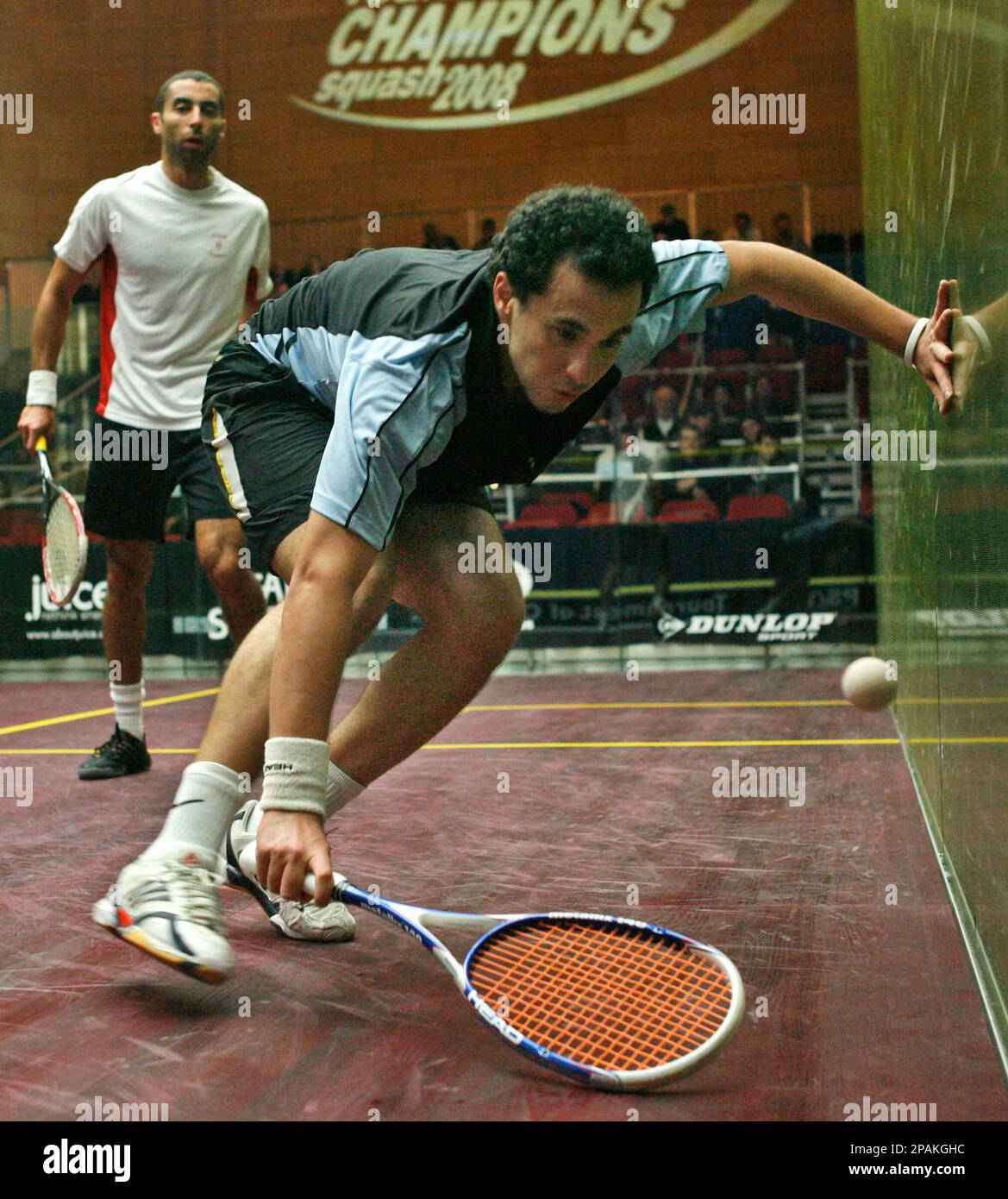 Mohammed Abbas, left, of Egypt, watches as qualifier Anwar Reda, also ...