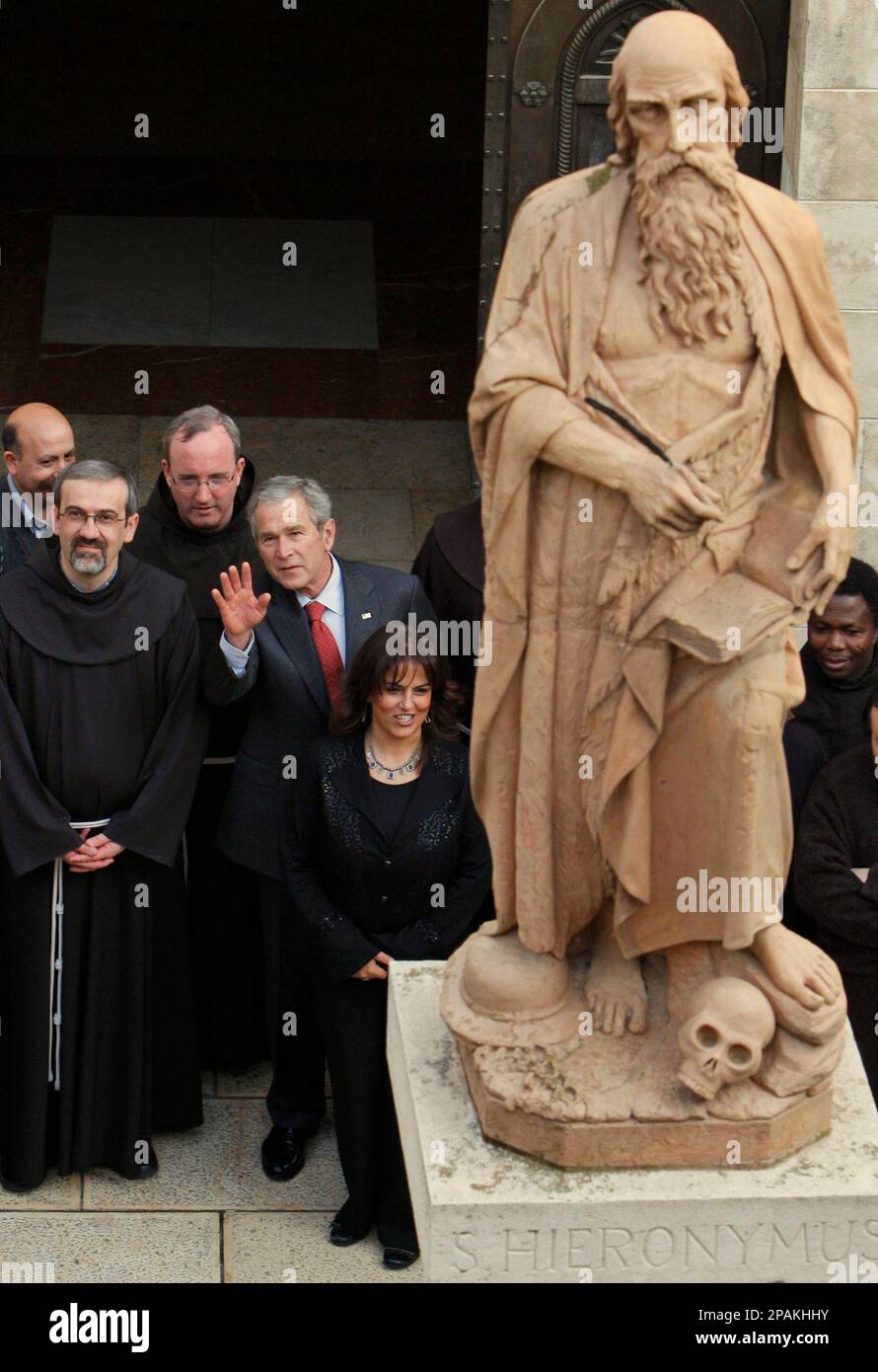 A statue of Saint Hieronymus is seen as President Bush stands with ...