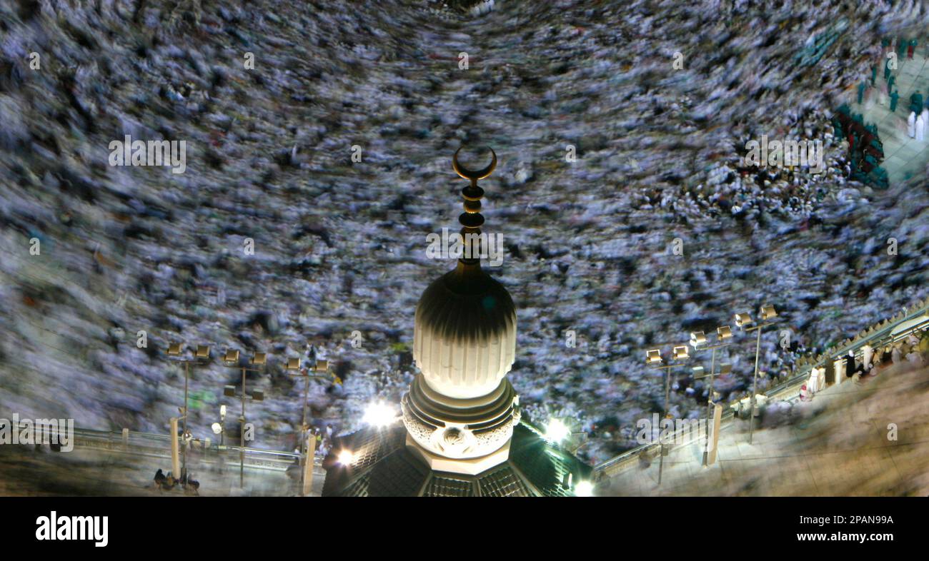 A minaret of Grand mosque is seen in foreground as Muslim pilgrims ...