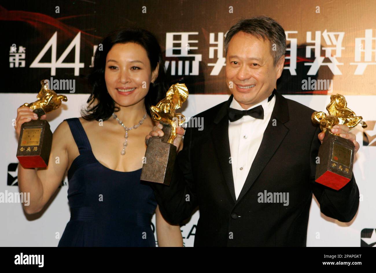 Taiwan director Ang Lee, right, displays his awards won for his film ...