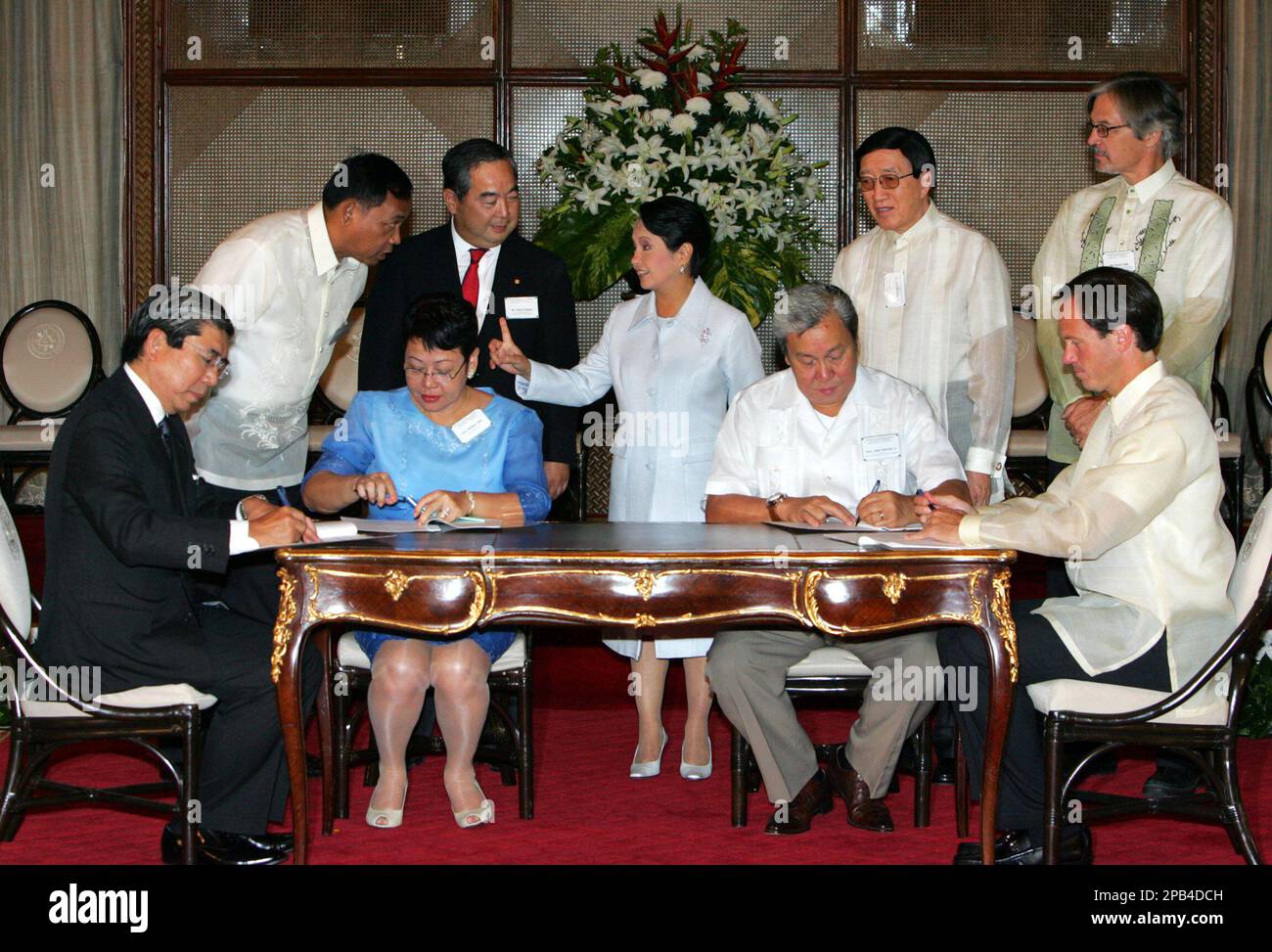 Philippine President Gloria Macapagal Arroyo, center, gestures as she ...