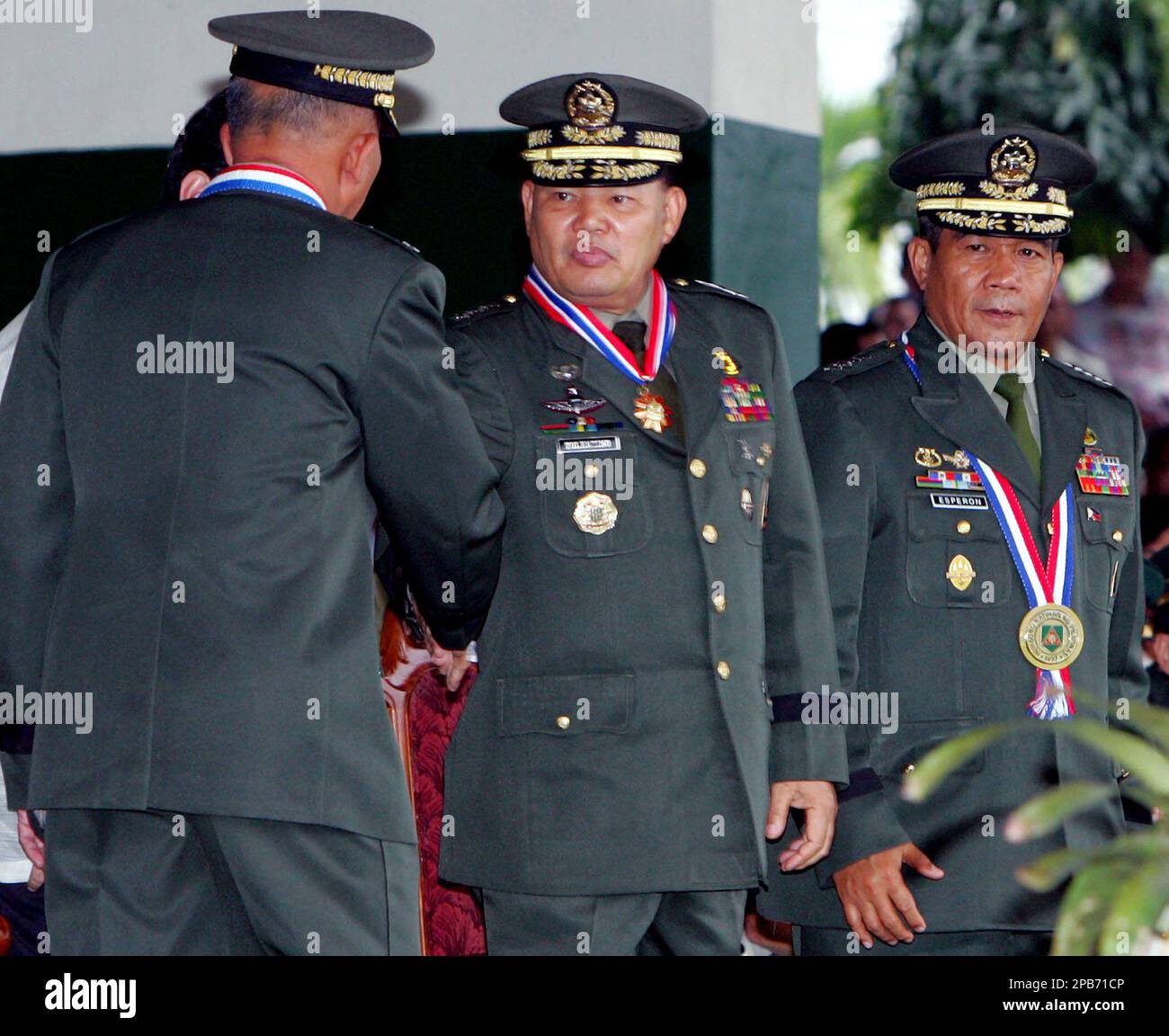 Outgoing Philippine Army Chief Lt. Gen. Romeo Tolentino, center ...