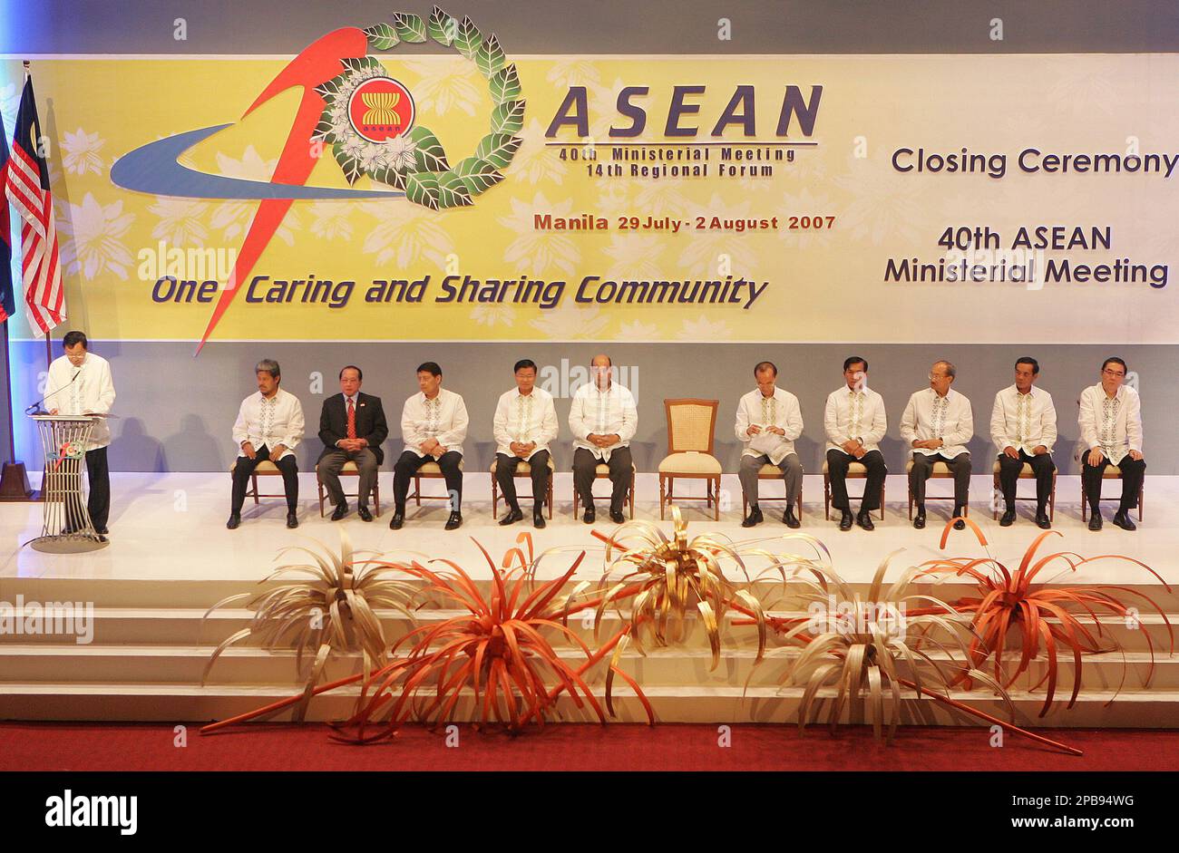 Philippine Foreign Secretary Alberto Romulo, left, speaks during the ...