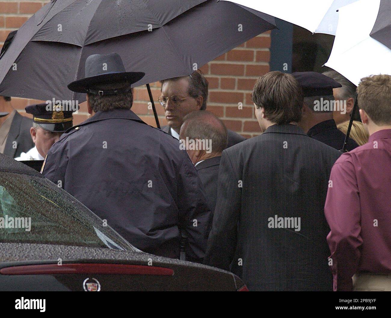 Dr. William Petit Jr., center, leaves a memorial service for his wife ...