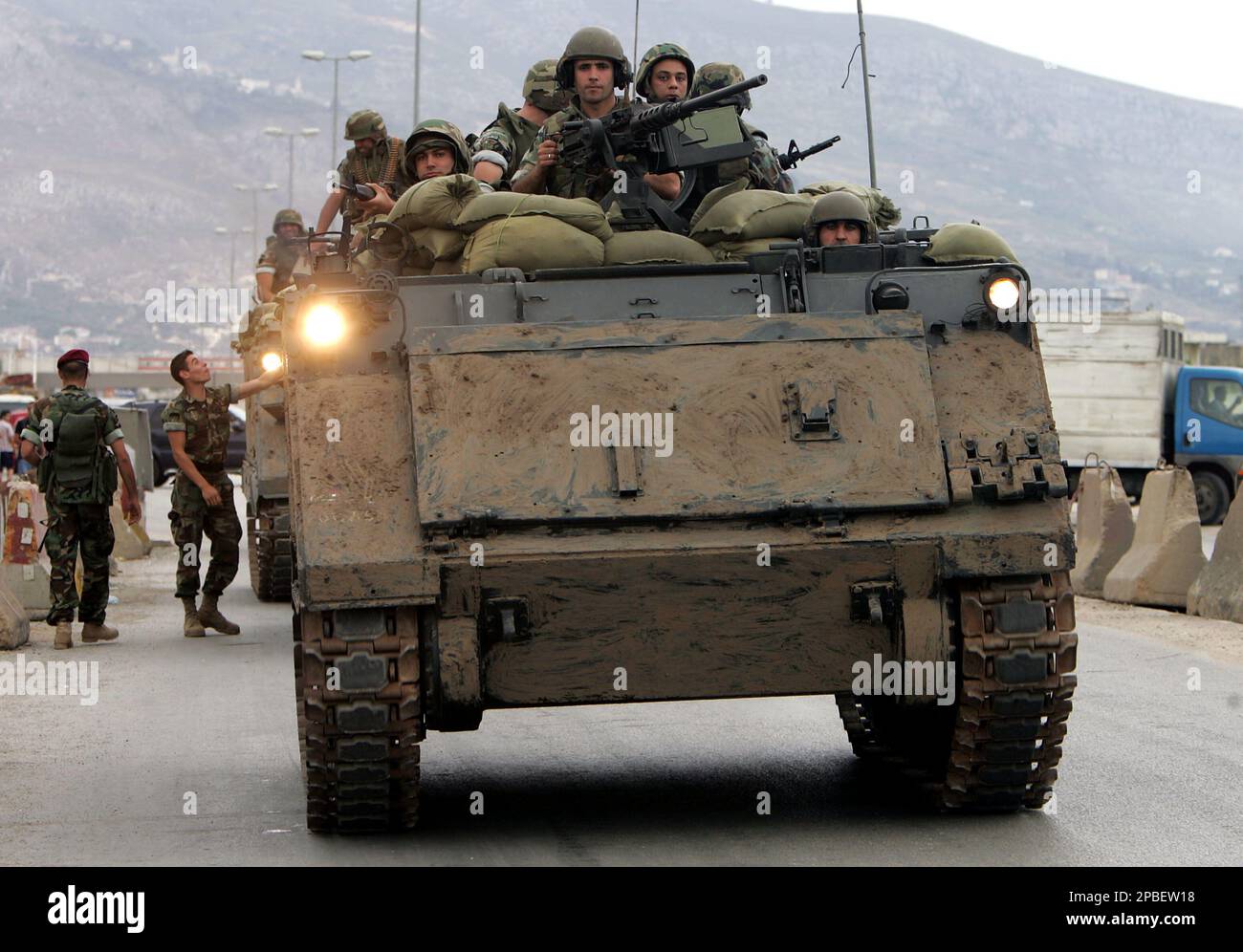 Lebanese army soldiers from navy commando units, atop their armored ...