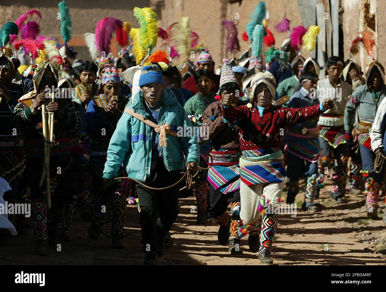 Quechua indigenous people, wearing traditional clothes, dance during ...