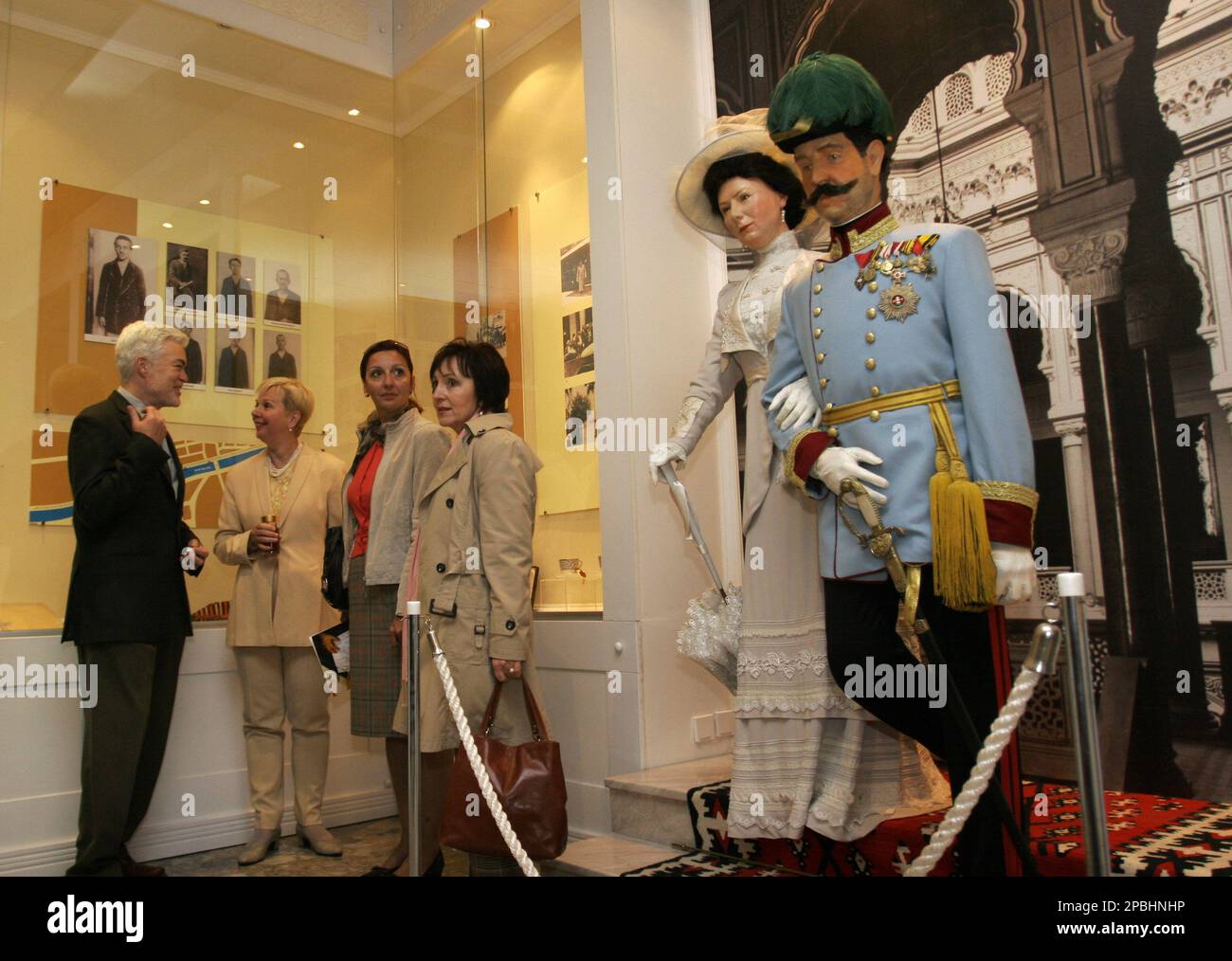 Sarajevans stand by the statues of Archduke Franz Ferdinand and his wife Sophie exhibited at ...