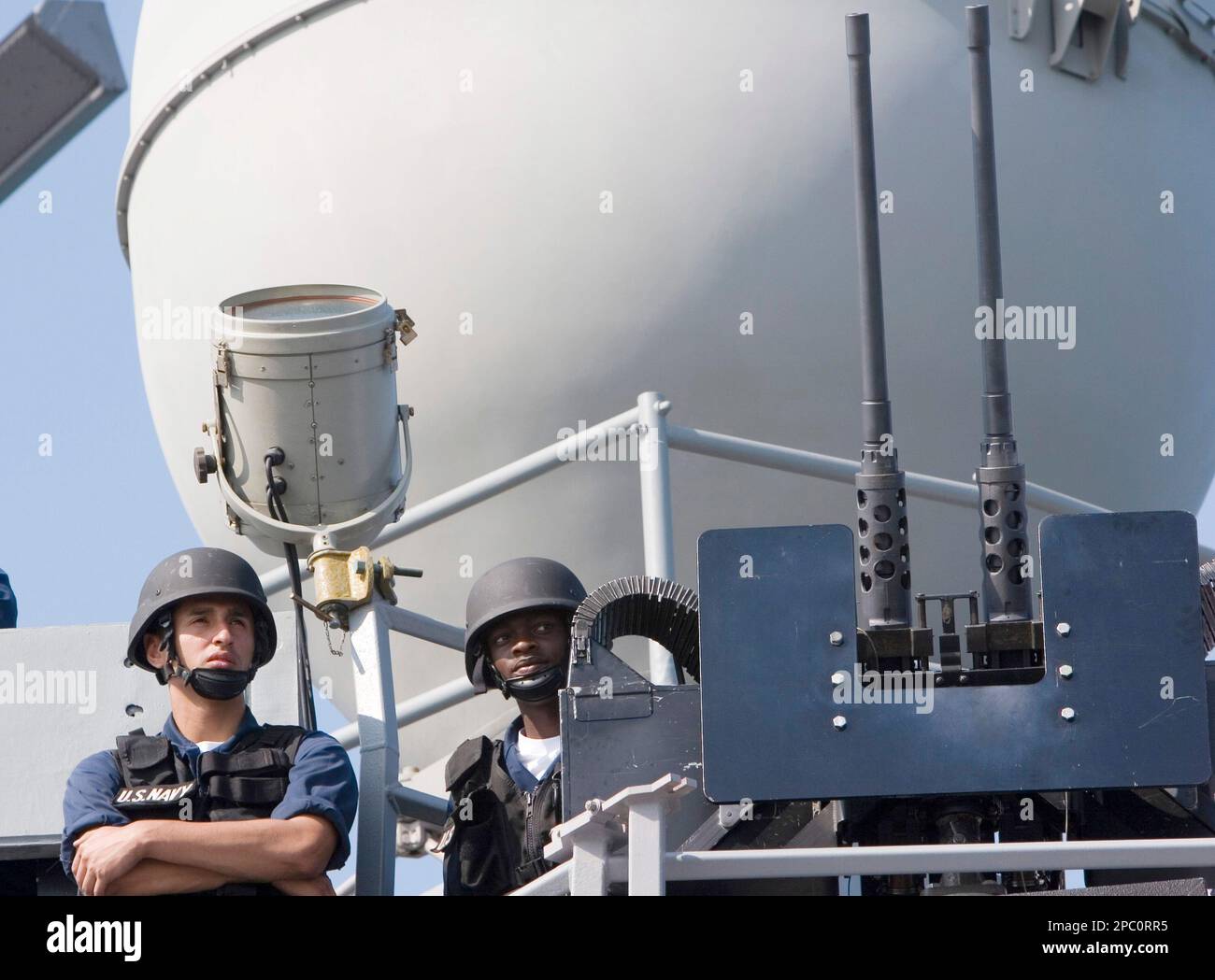 U.S. crews members look on as their USS Gary warship arrives at ...
