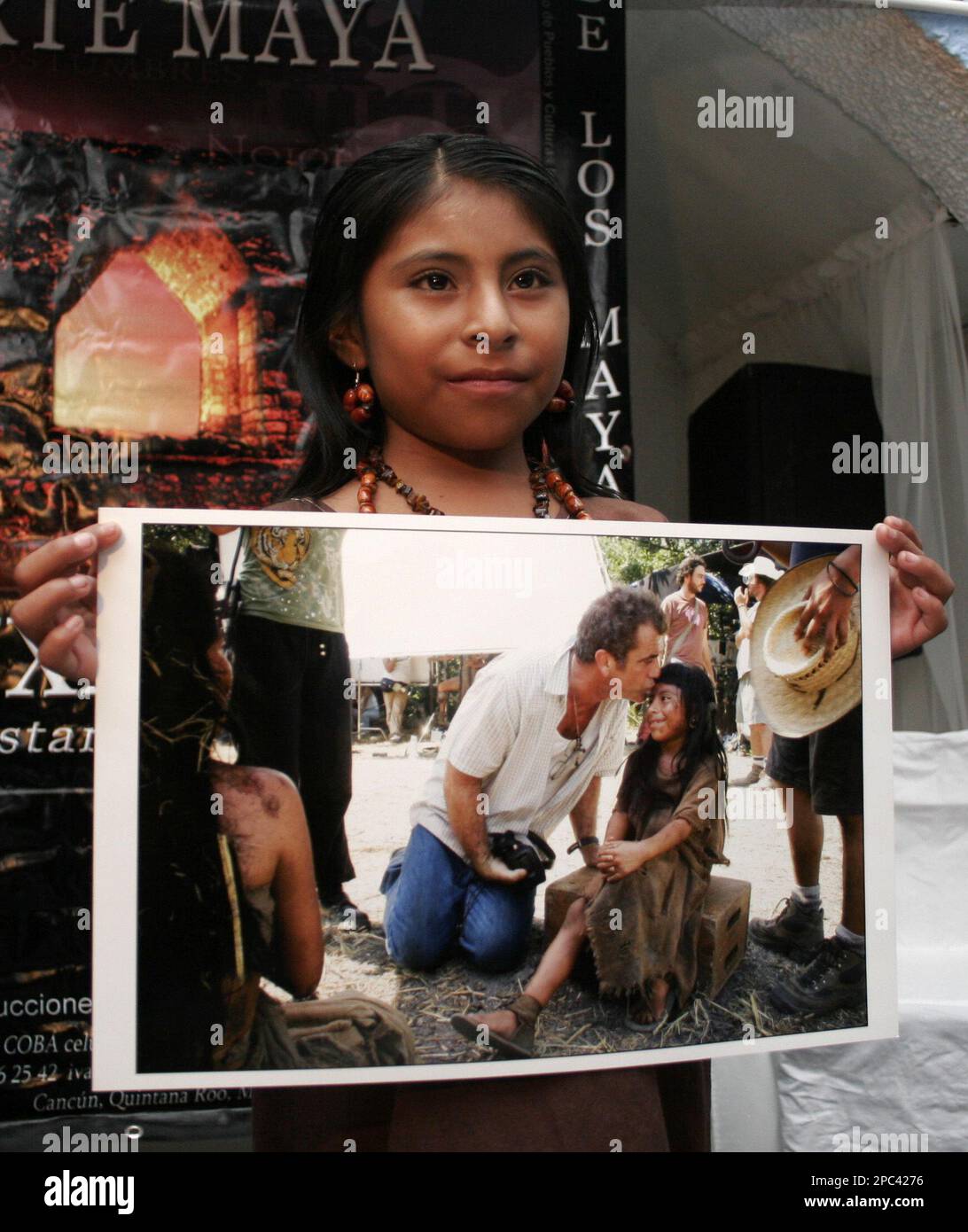 Maria Isidra Hoil Mukul, 8, holds a photo of herself with actor ...