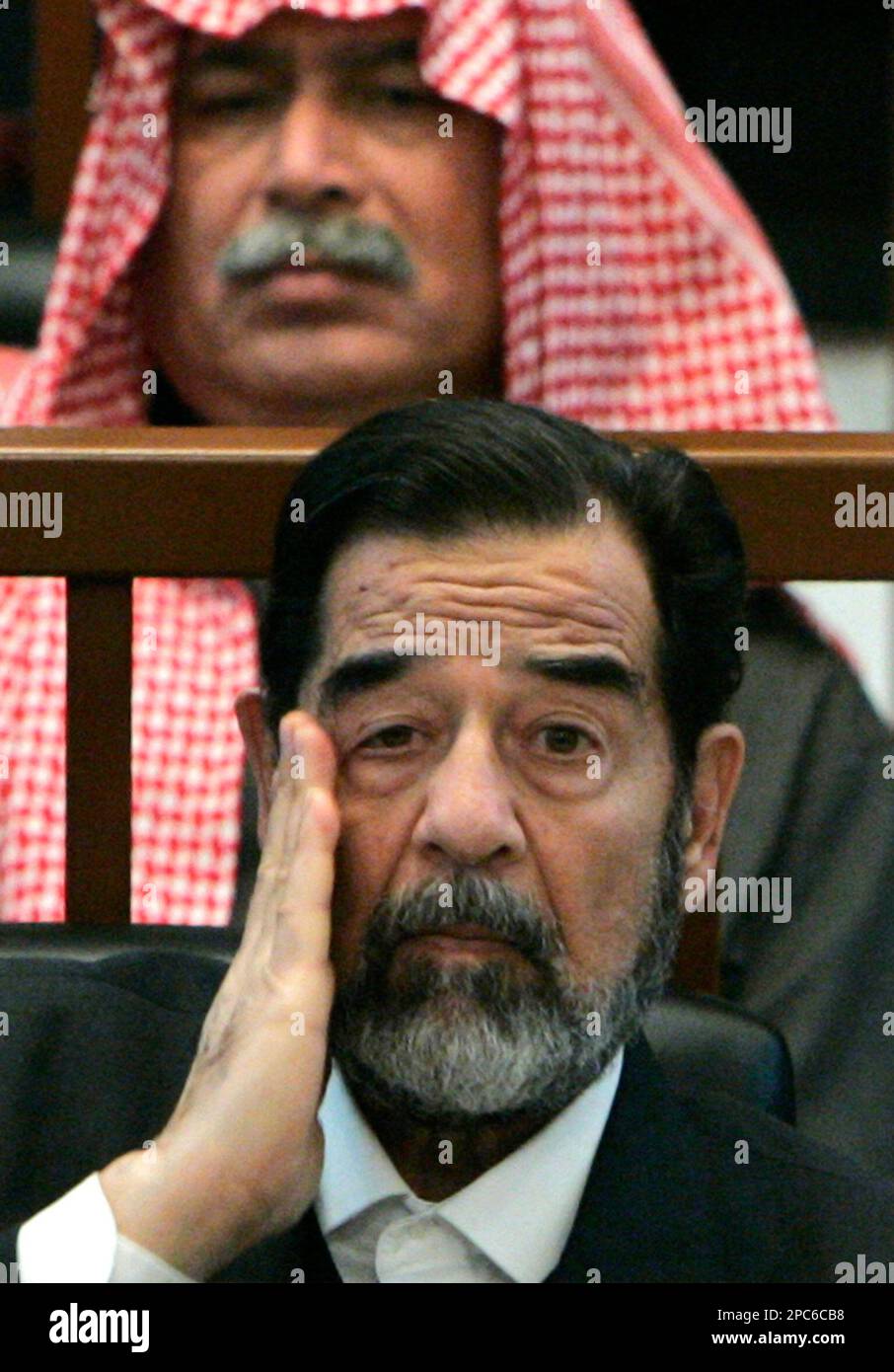 Ousted Iraqi President Saddam Hussein appears in court, with co ...