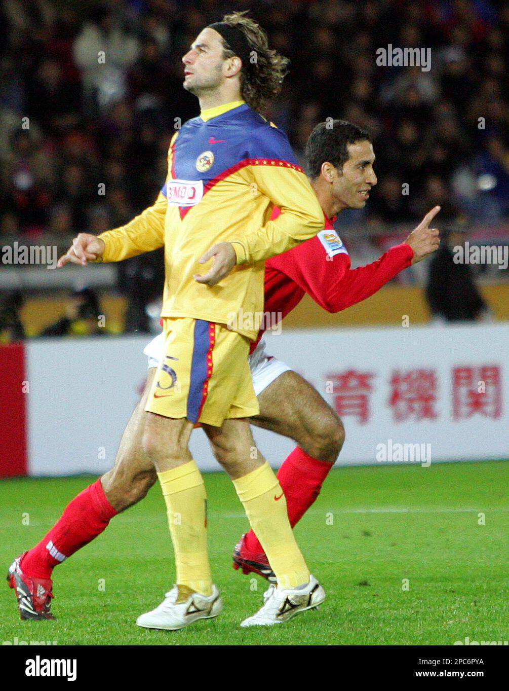 Egypt's Al Ahly's Mohamed Aboutrika, right, reacts after scoring his ...