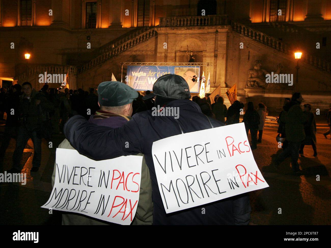 Demonstrators gather during a vigil to show solidarity with Welby, at ...