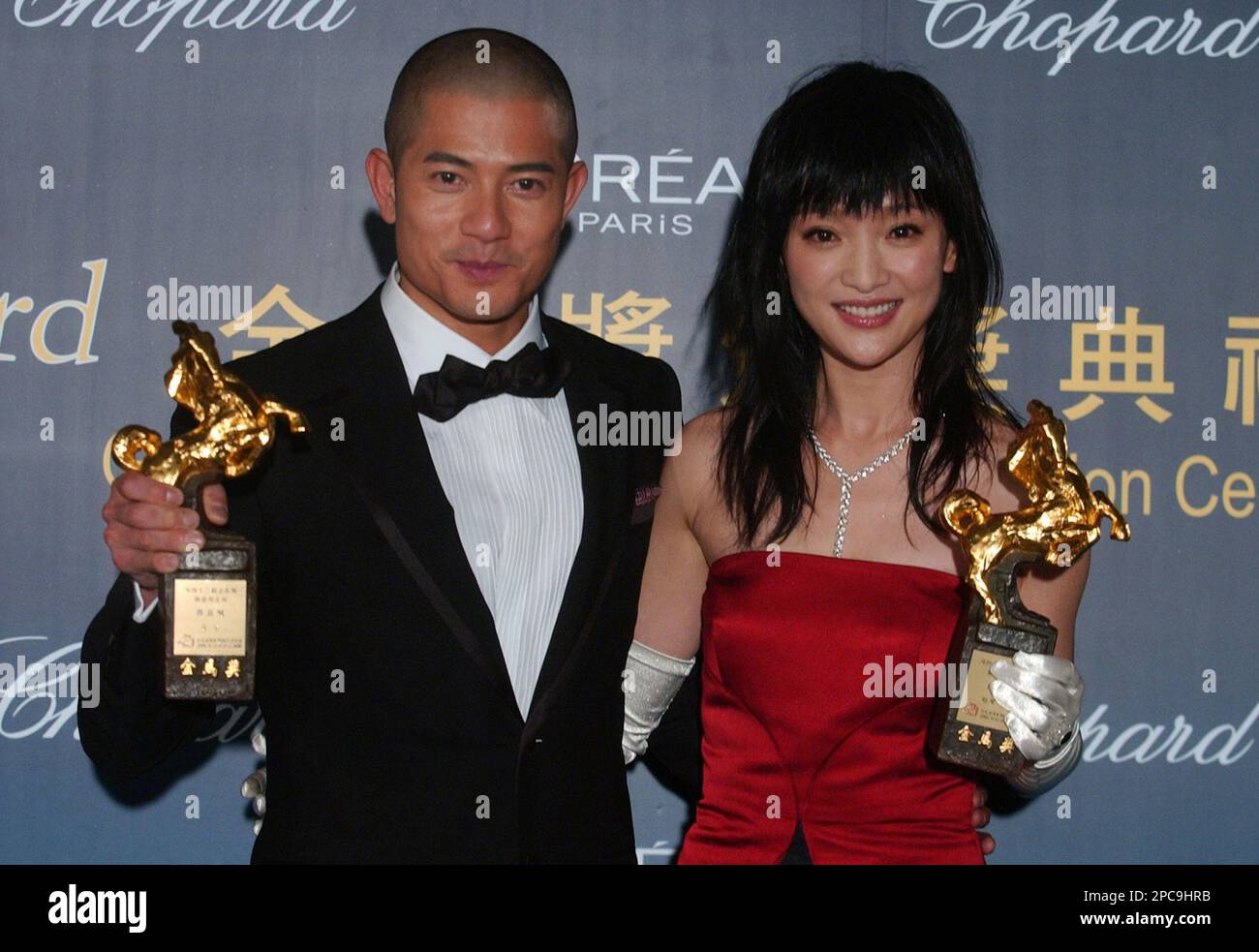 Hong Kong actor Aaron Kwok and Chinese actress Zhou Xun display their ...
