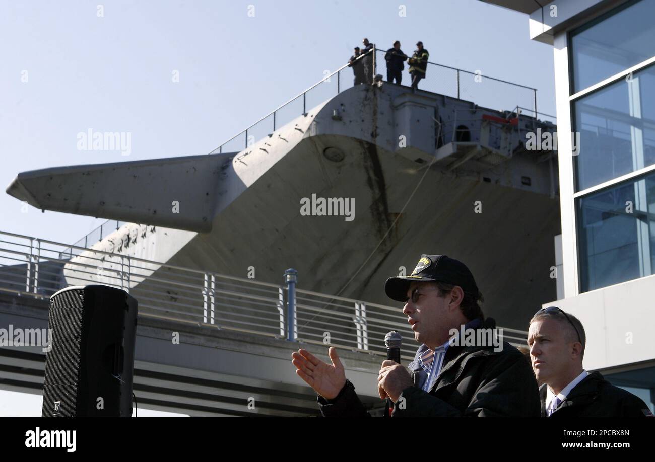 Captain Jeffrey McAllister, left, of McAllister Towing, and Bill White, right, president of the ...