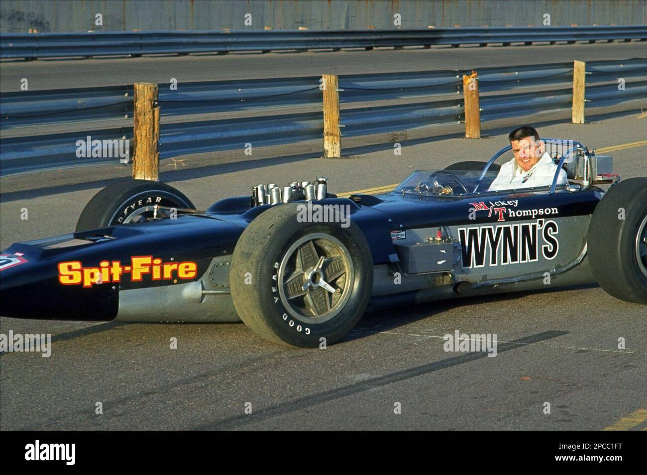** FILE ** Auto racing legend Mickey Thompson sits in his racing car ...