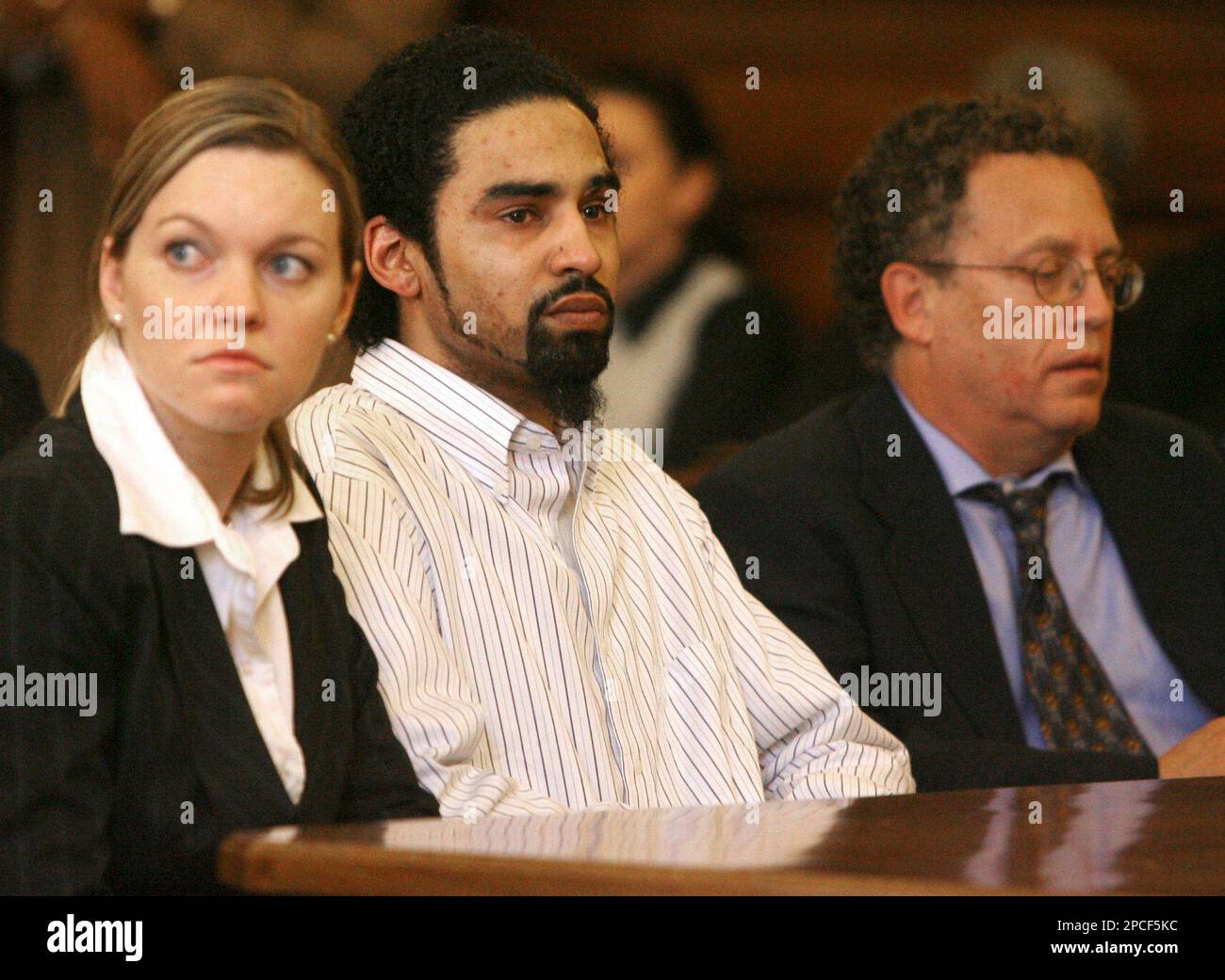 Convicted killer Esteban Carpio, center, cries while listening to his ...