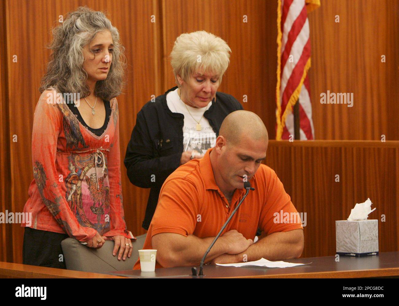 Jay McLaughlin reads a statement during court proceedings for Michael ...