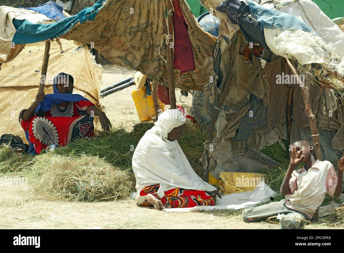 A Somali Muslim woman prays at her makeshift hut in Hargeisa ...