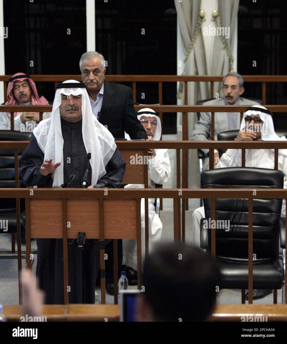 Co-defendant Sultan Hashim Ahmad al-Tai, front, stands in court during ...