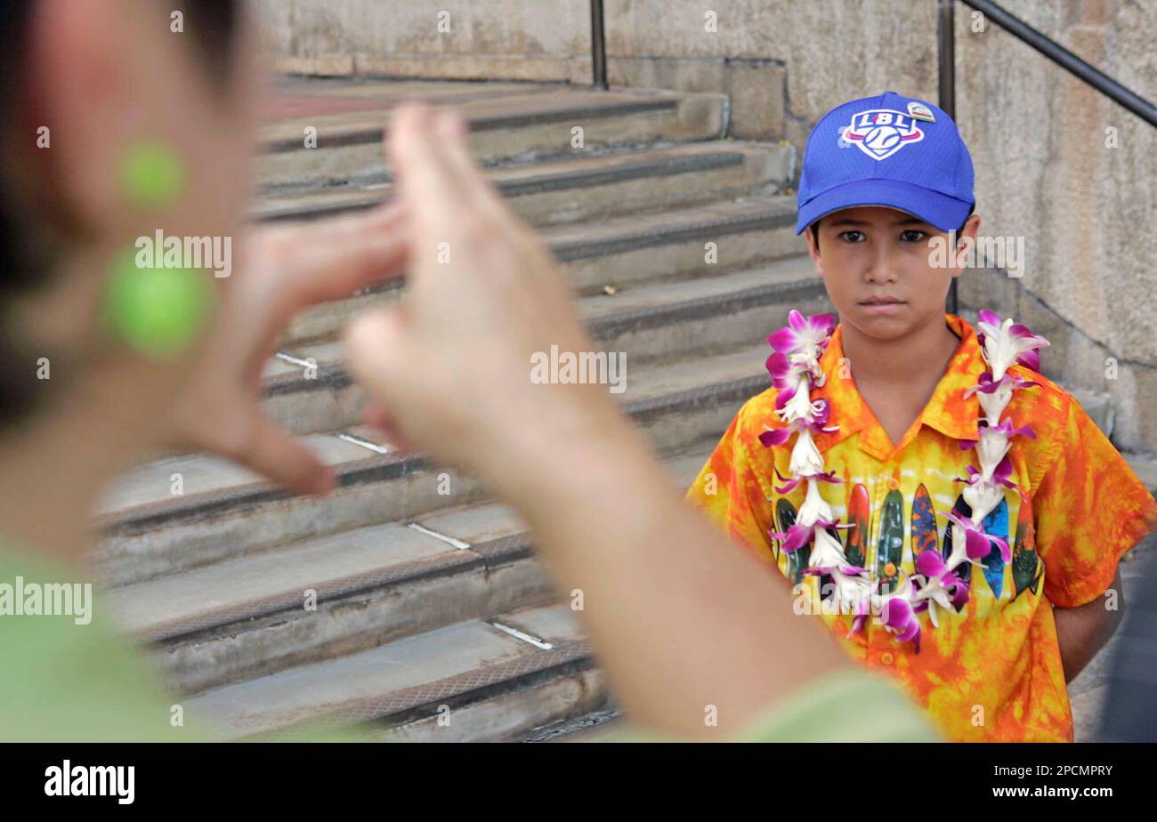 Deaf baseball player Justin "Pono" Tokioka, 11, watches his interpreter ...