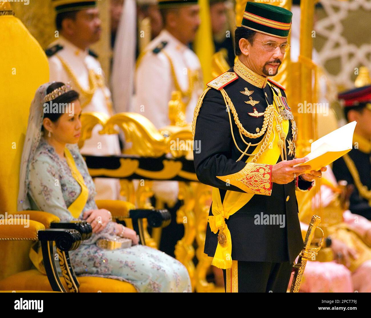 Brunei's Sultan Hassanal Bolkiah, right, delivers his speech at the ...