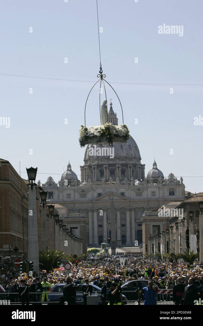 A Fatima statue, ferried by a helicopter, arrives near castel Sant ...