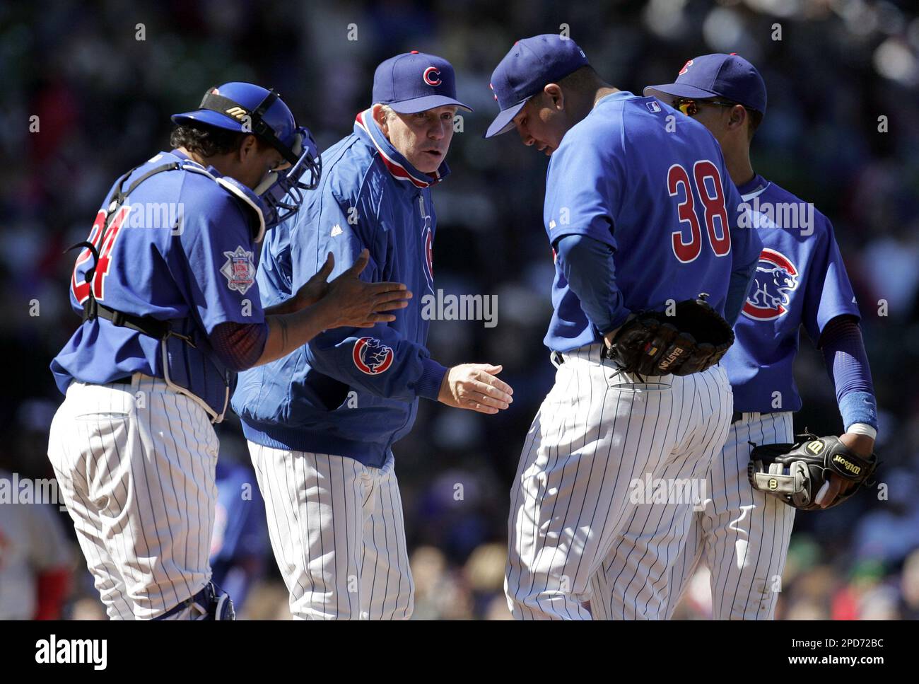 Chicago Cubs pitching coach Larry Rothschild, second from left, talks ...