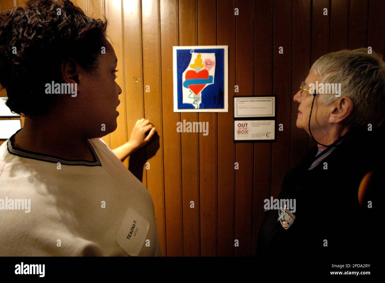 Teaona Payne, left, who is homeless, discusses her artwork with art ...