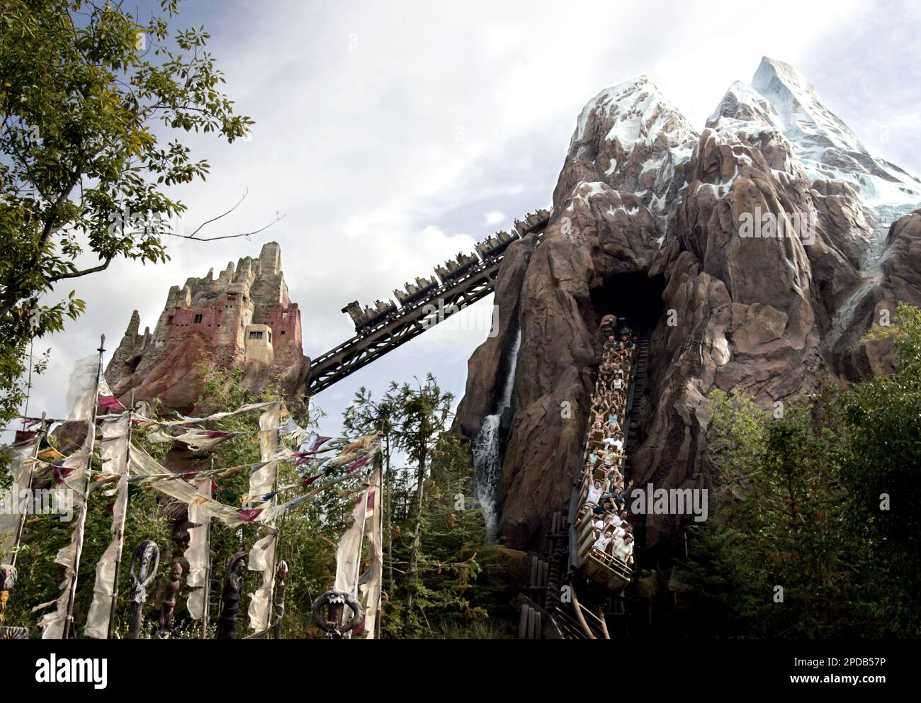 Visitors experience the Expedition Everest roller coaster at the Animal ...