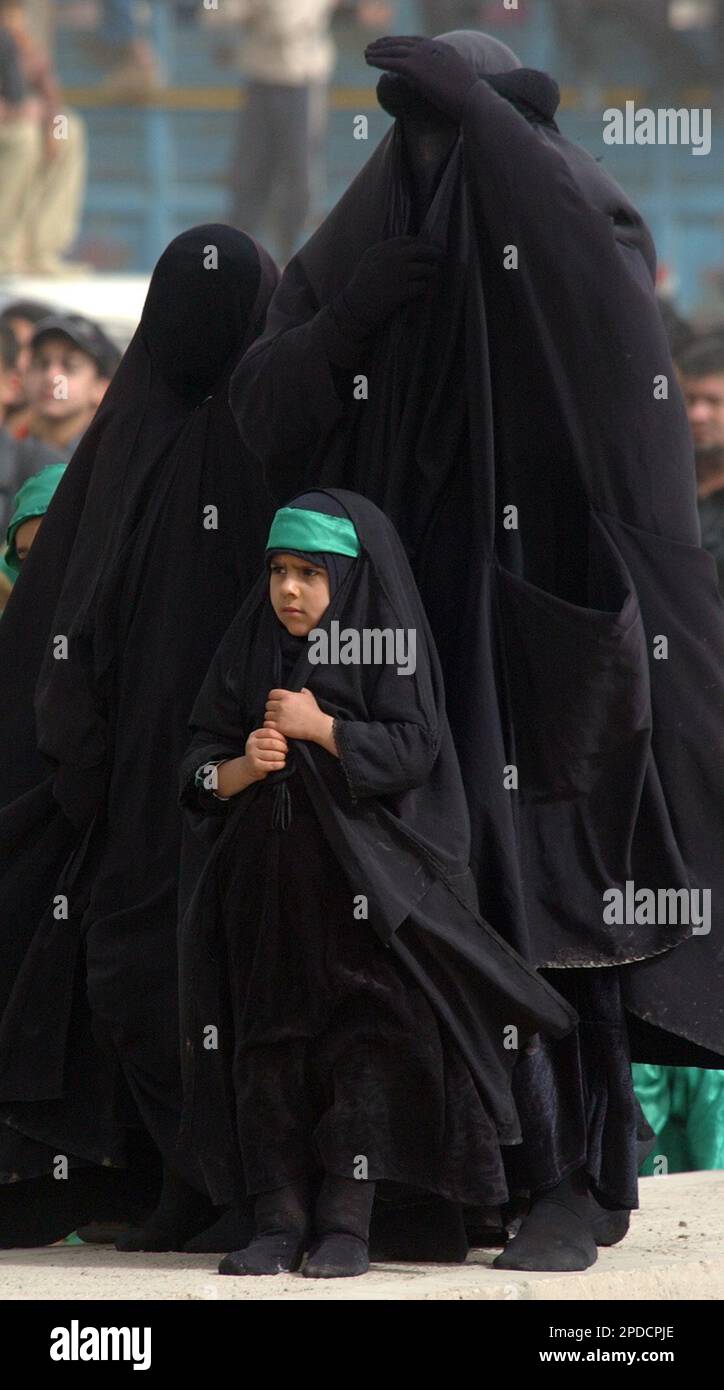 Women and children participate in a re-enacted battleof Karbala held on ...