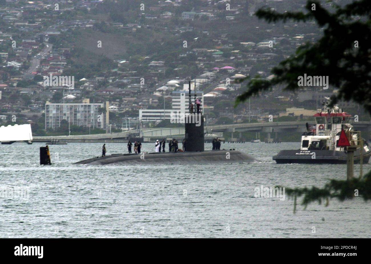 ** FILE ** The submarine USS Greeneville is escorted to the submarine ...