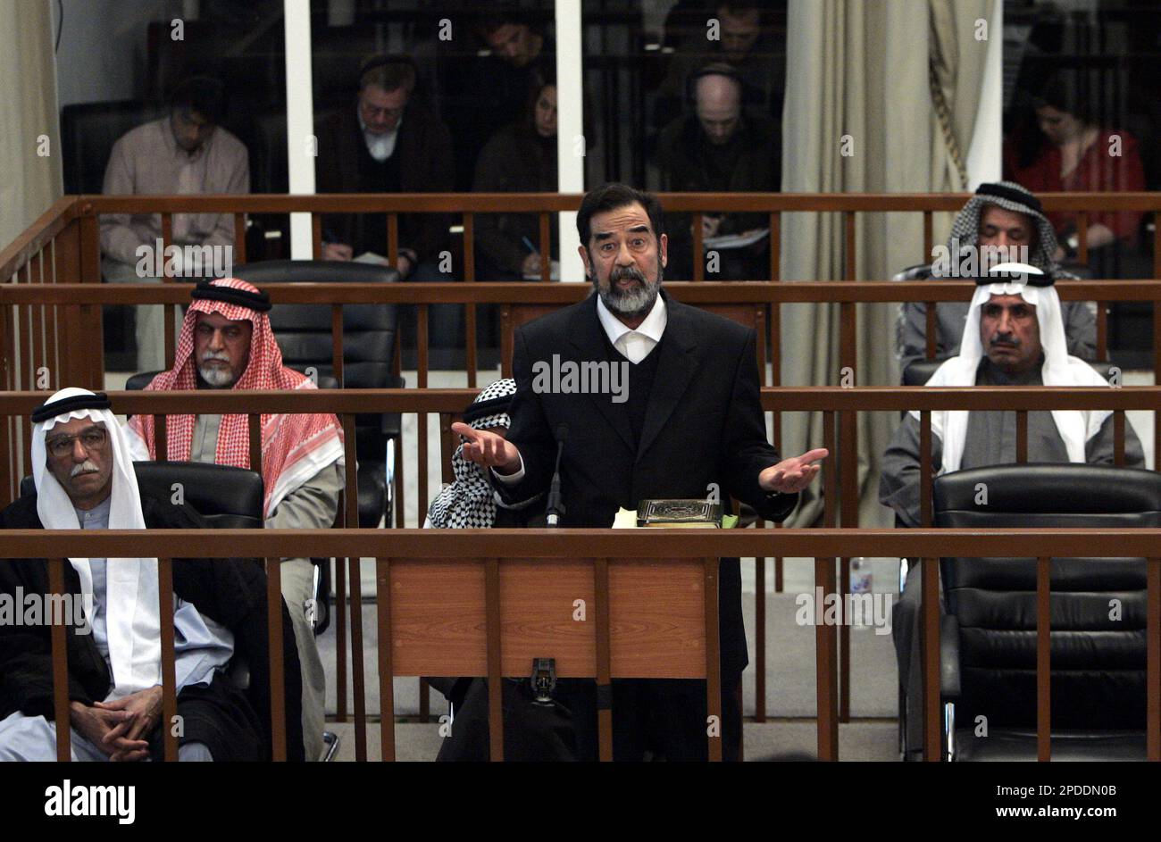 Former Iraqi President Saddam Hussein argues with chief judge, Raouf ...