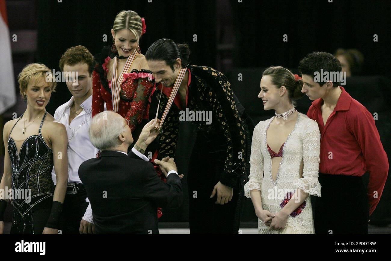 ISU Council member Courtney Jones, foreground, presents a gold medal to ...
