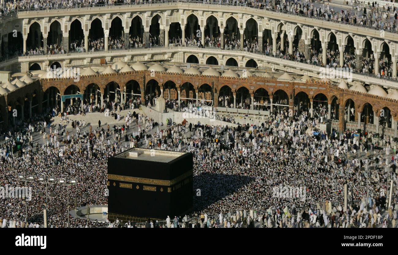 Muslim pilgrims pray and circle around the Kaaba, center, inside the ...
