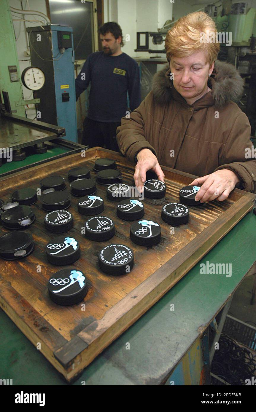 Gufex family company co-owner Lenka Mrackova checks some of 3,500 pucks ...