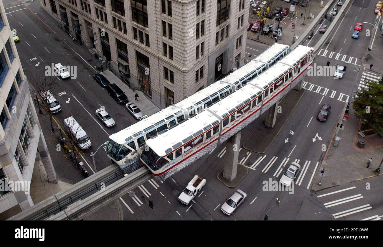 Two monorail trains sit on their tracks smashed together above Fifth ...
